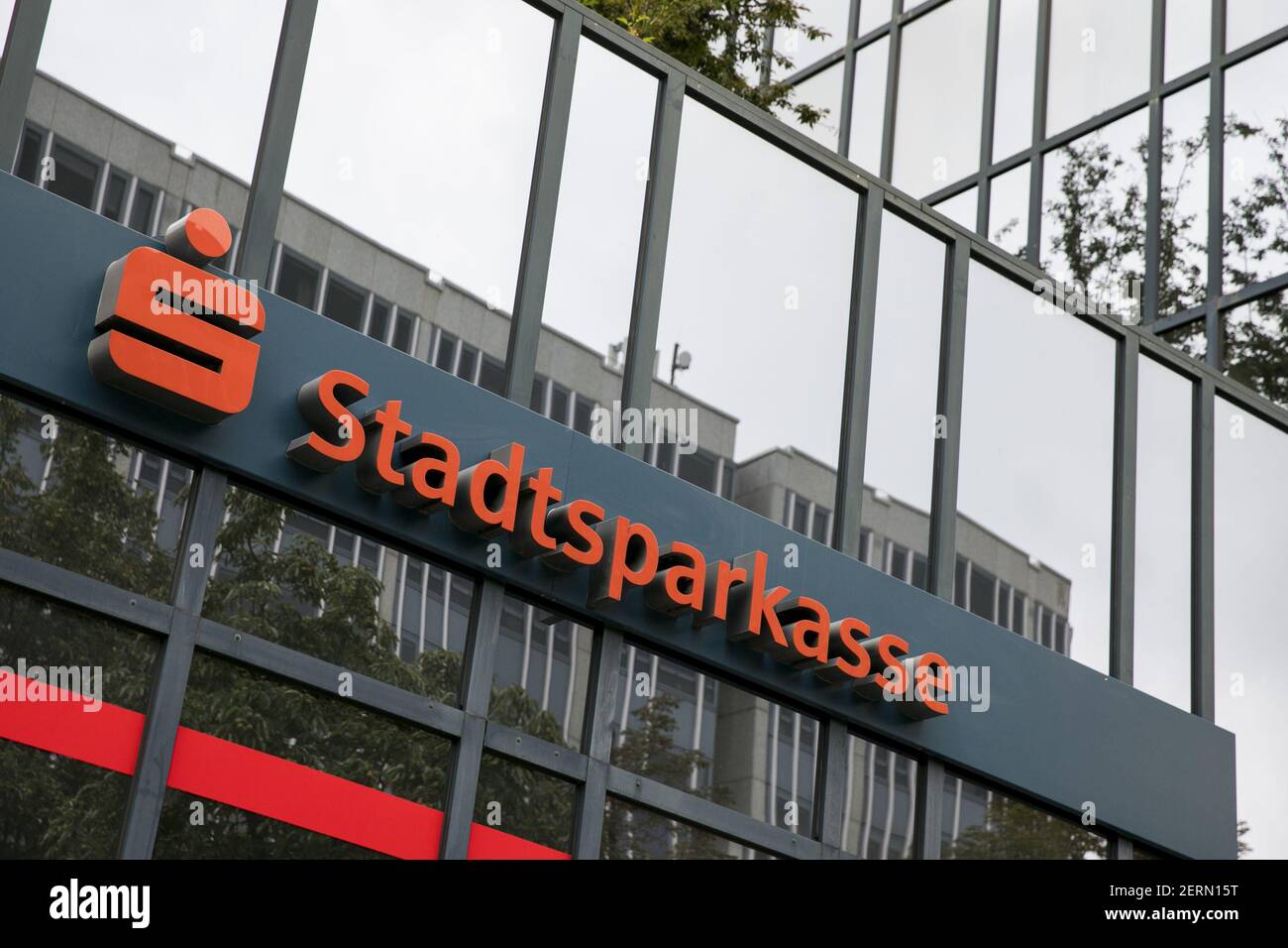 A logo sign outside of the headquarters of Stadtsparkasse München in ...