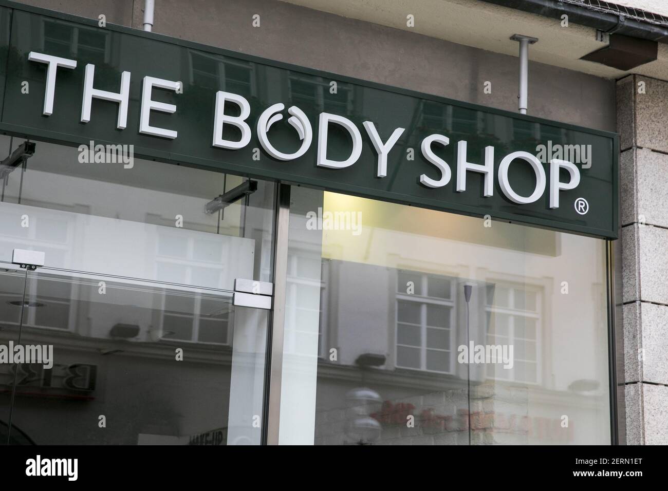A logo sign outside of a The Body Shop retail store in Munich, Germany ...
