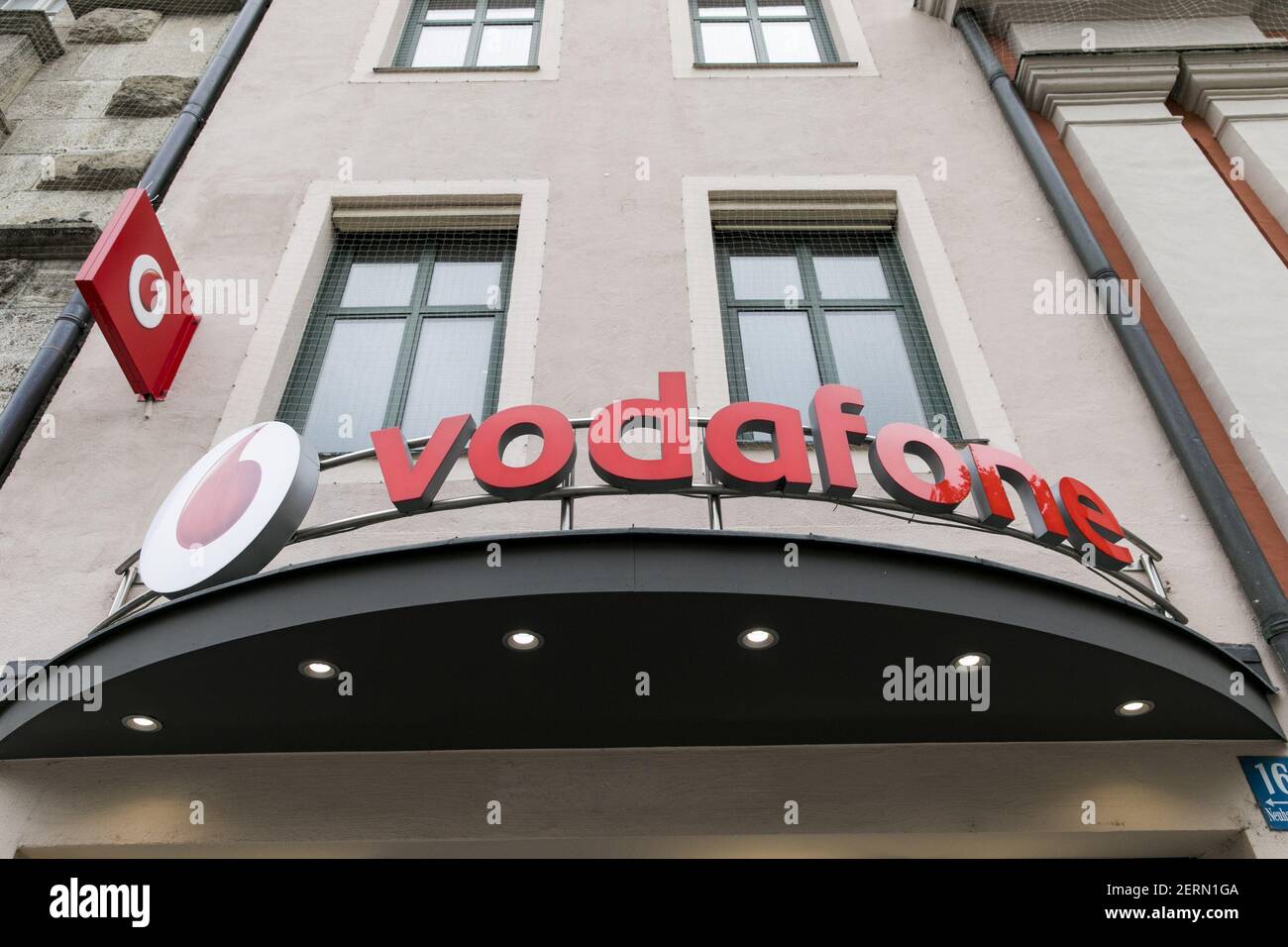 A logo sign outside of a Vodafone retail store in Munich, Germany, on ...