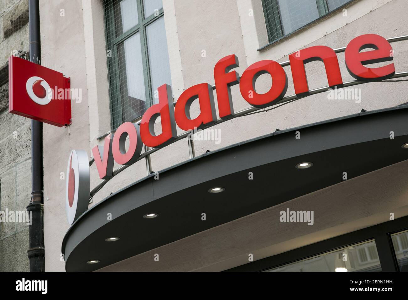 A logo sign outside of a Vodafone retail store in Munich, Germany, on ...