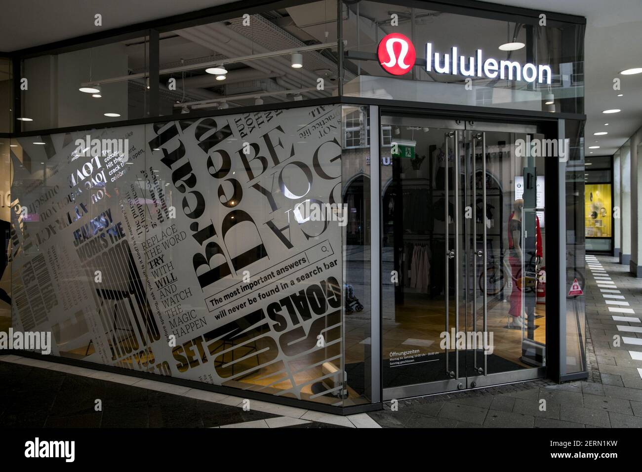 A logo sign outside of a Lululemon Athletica retail store in Munich ...