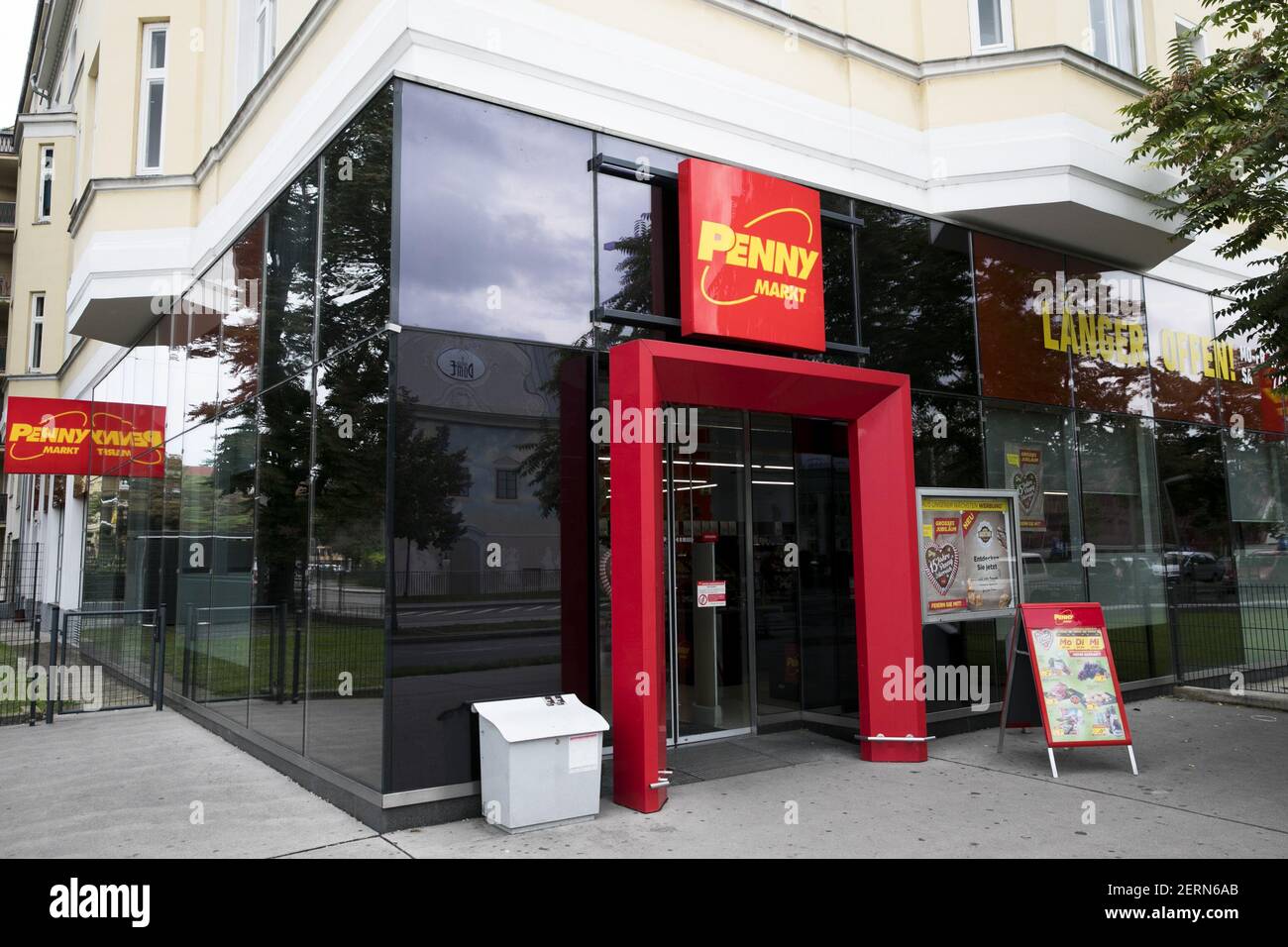 A logo sign outside of a Penny Markt retail grocery store in Vienna ...