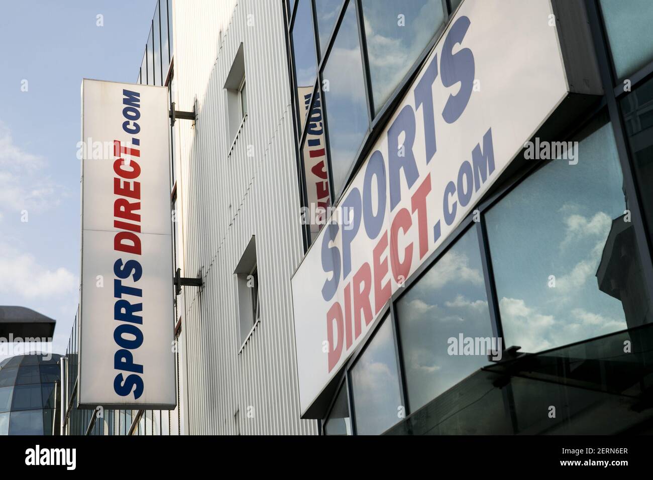 A logo sign outside of a Sports Direct International retail store in ...
