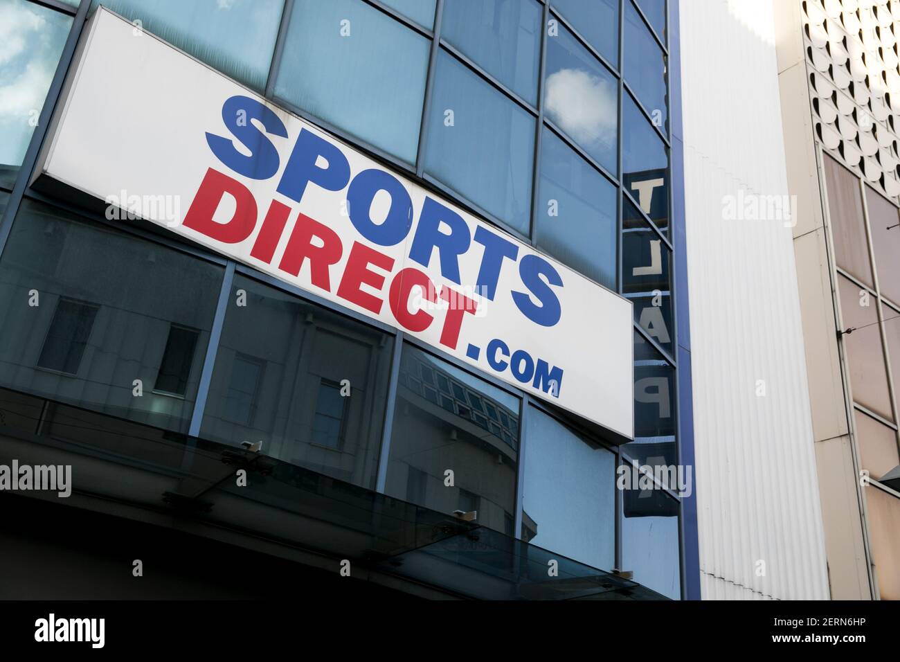 A logo sign outside of a Sports Direct International retail store in ...