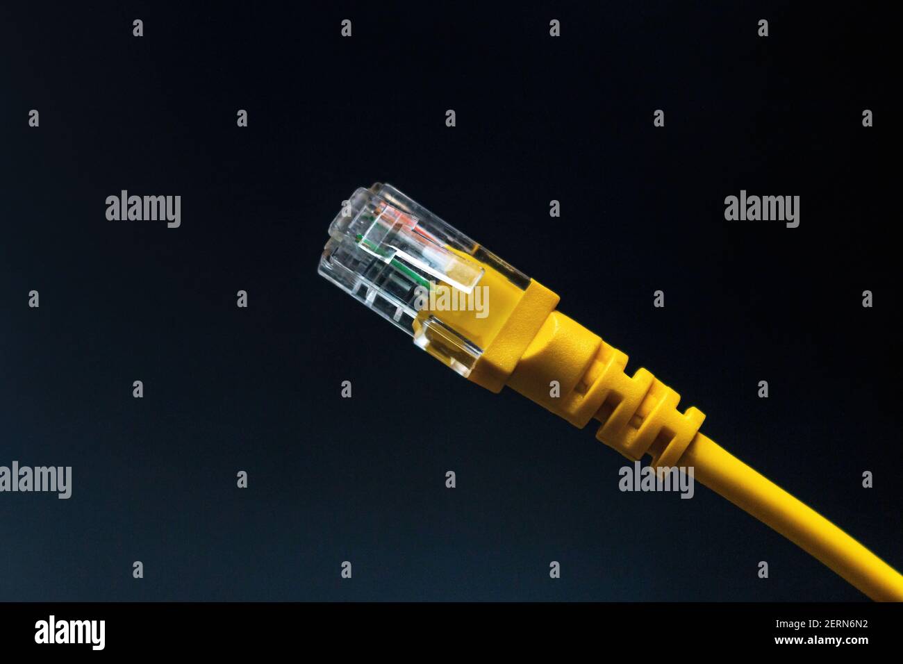 yellow network internet cable on black background close-up Stock Photo ...