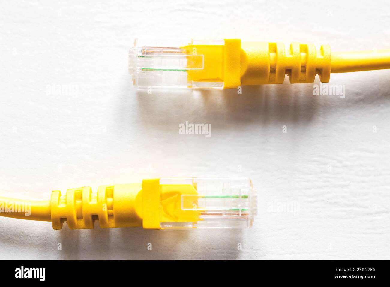 yellow network internet cable on a white background close-up Stock ...