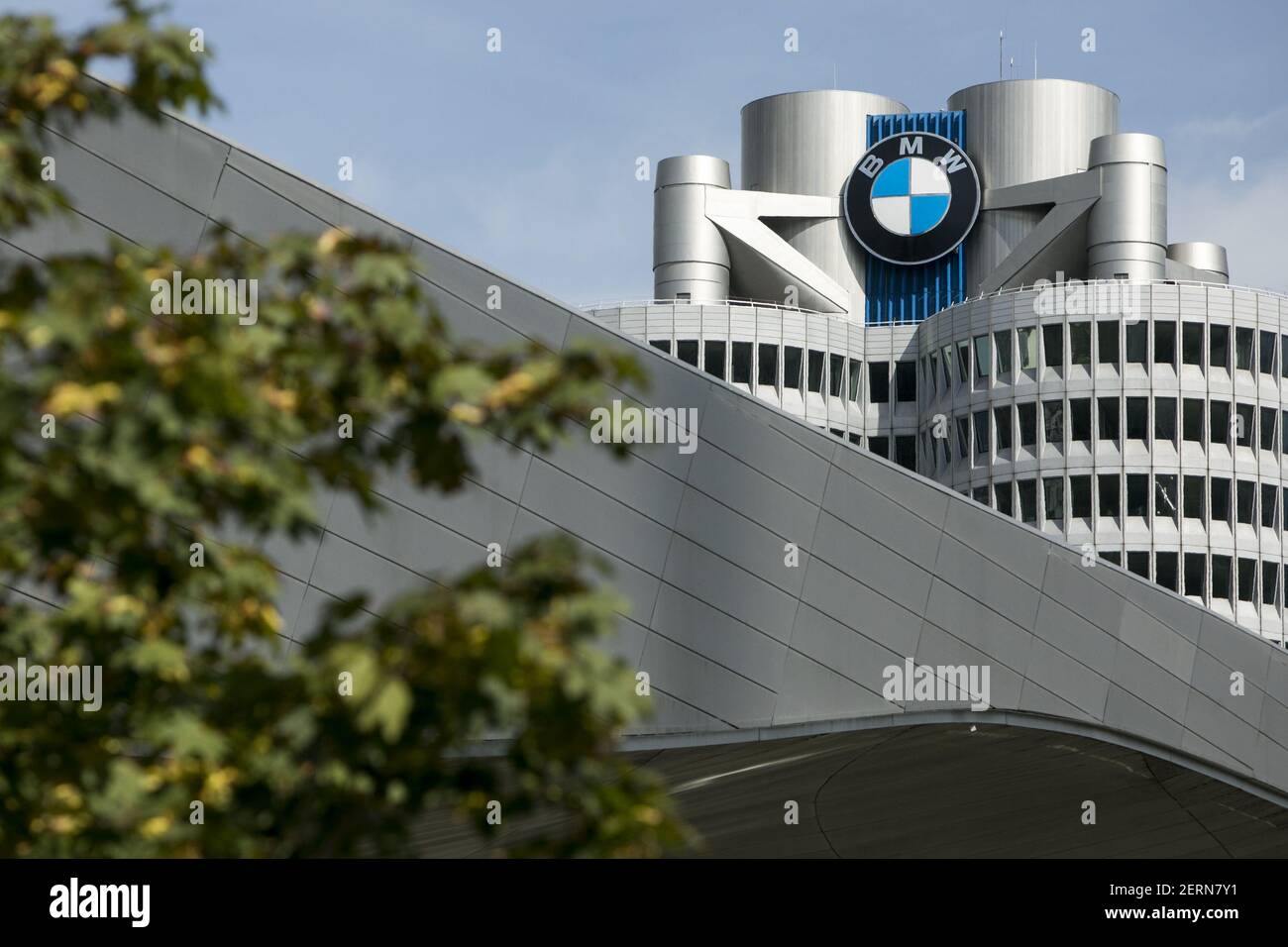A logo sign outside of the headquarters of the BMW Group (Bayerische ...