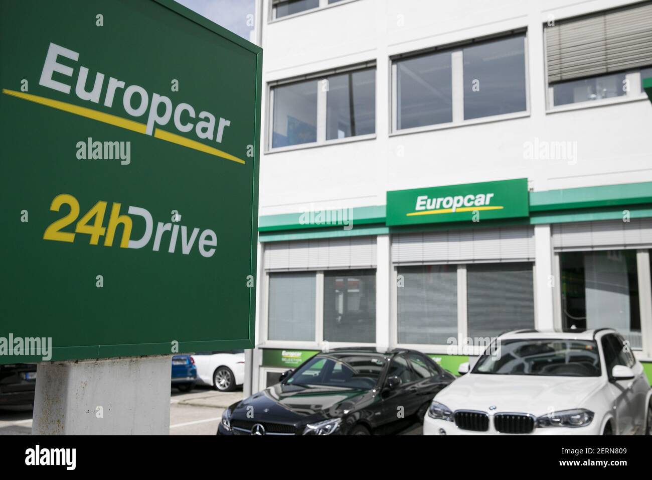 A logo sign outside of a Europcar Mobility Group car rental location in ...