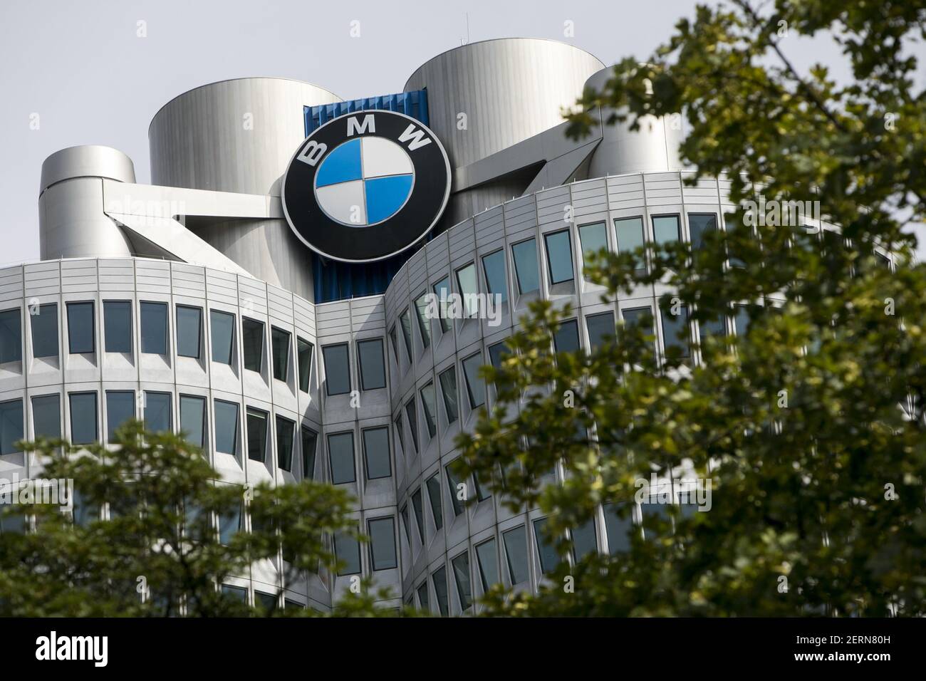 A logo sign outside of the headquarters of the BMW Group (Bayerische ...