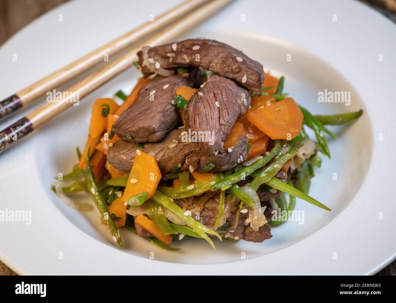 Recipe Sesame beef wok, minced summer vegetables Stock Photo - Alamy