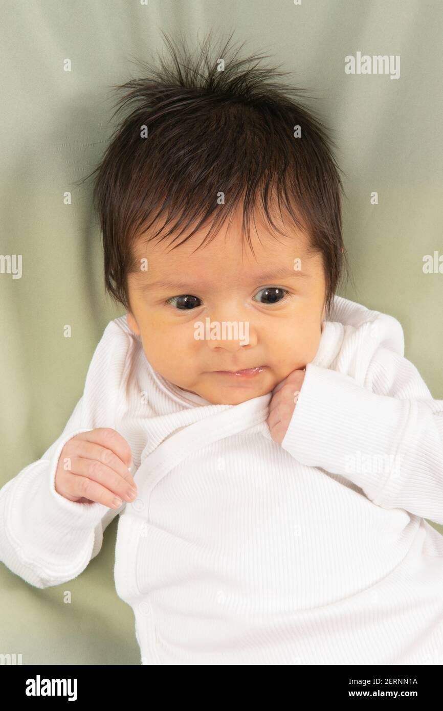Newborn baby girl lying hi-res stock photography and images - Alamy