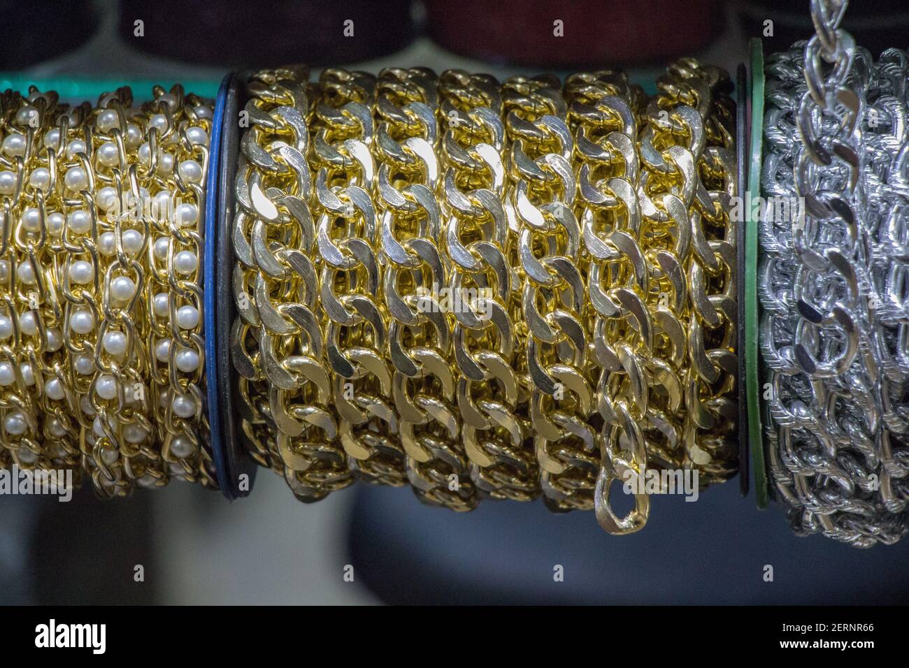 Rolls of decorative chains in view Stock Photo - Alamy