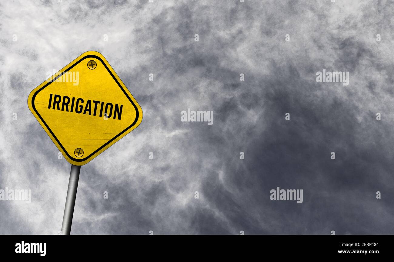 Irrigation - yellow sign with cloudy background Stock Photo - Alamy