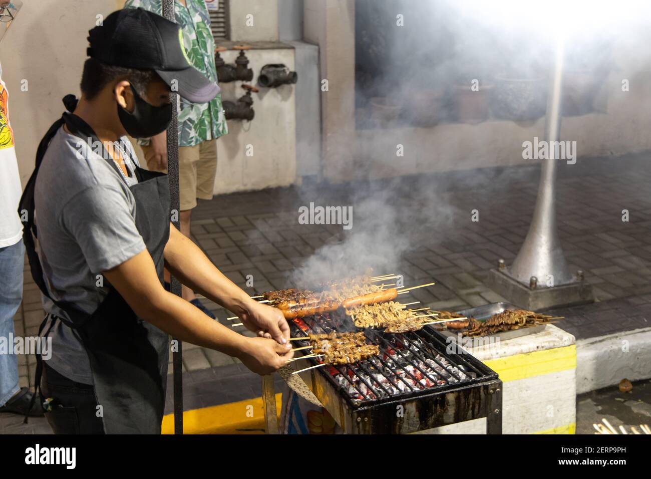 Feb 14, 2021 Man grilling barbecue at the Sunday market at Makati city ...