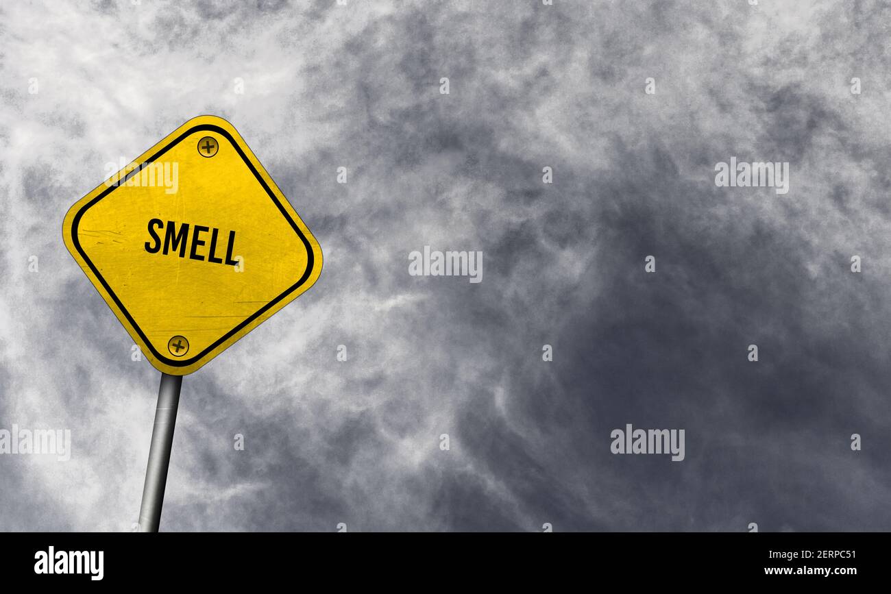 Smell - yellow sign with cloudy background Stock Photo - Alamy