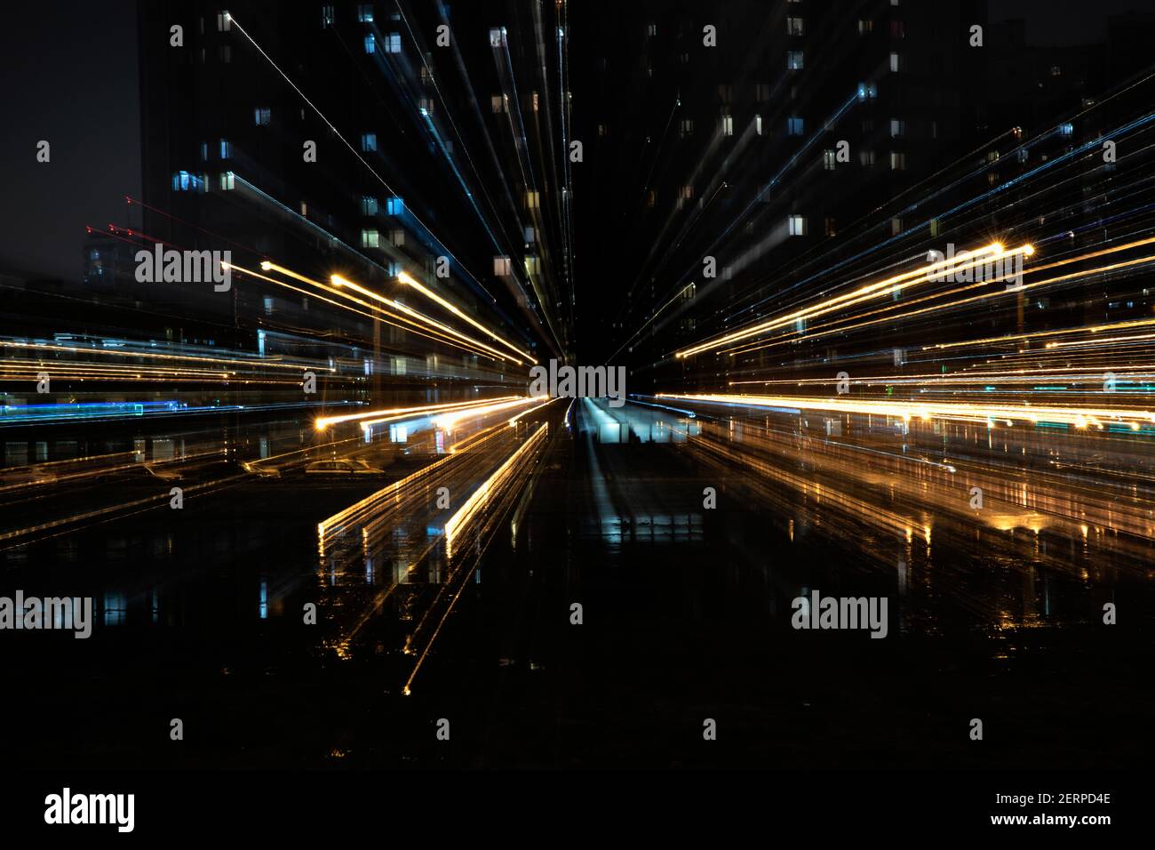 Night building with glowing windows and zoom effect with colorful beams ...