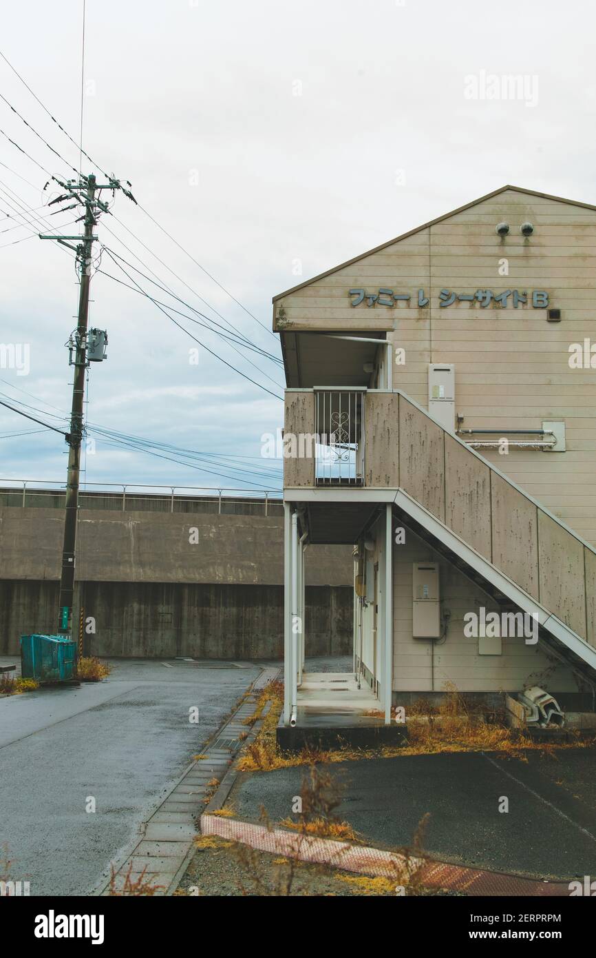 A apartment facility beside a sea wall in November 20, 2020 in Miyako ...