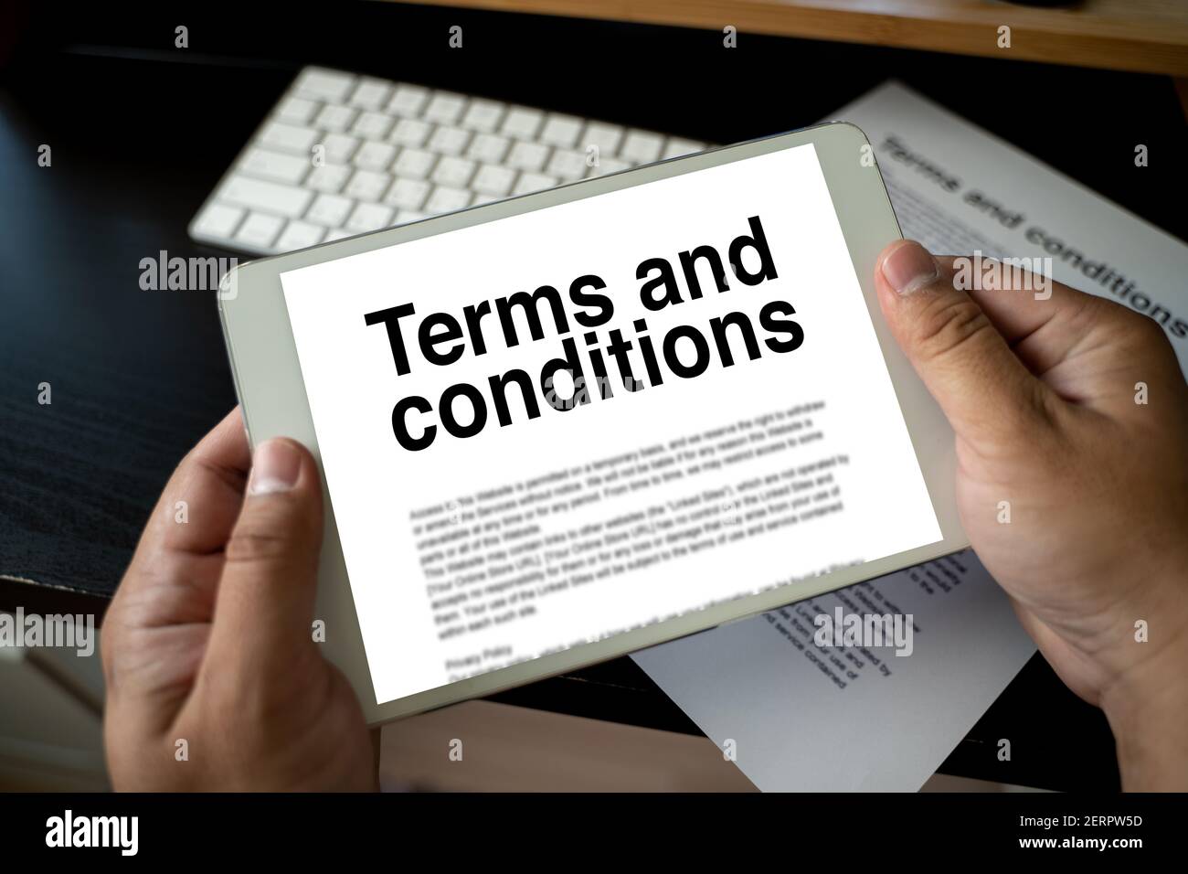 Terms and conditions businessman reviewing terms and conditions of ...