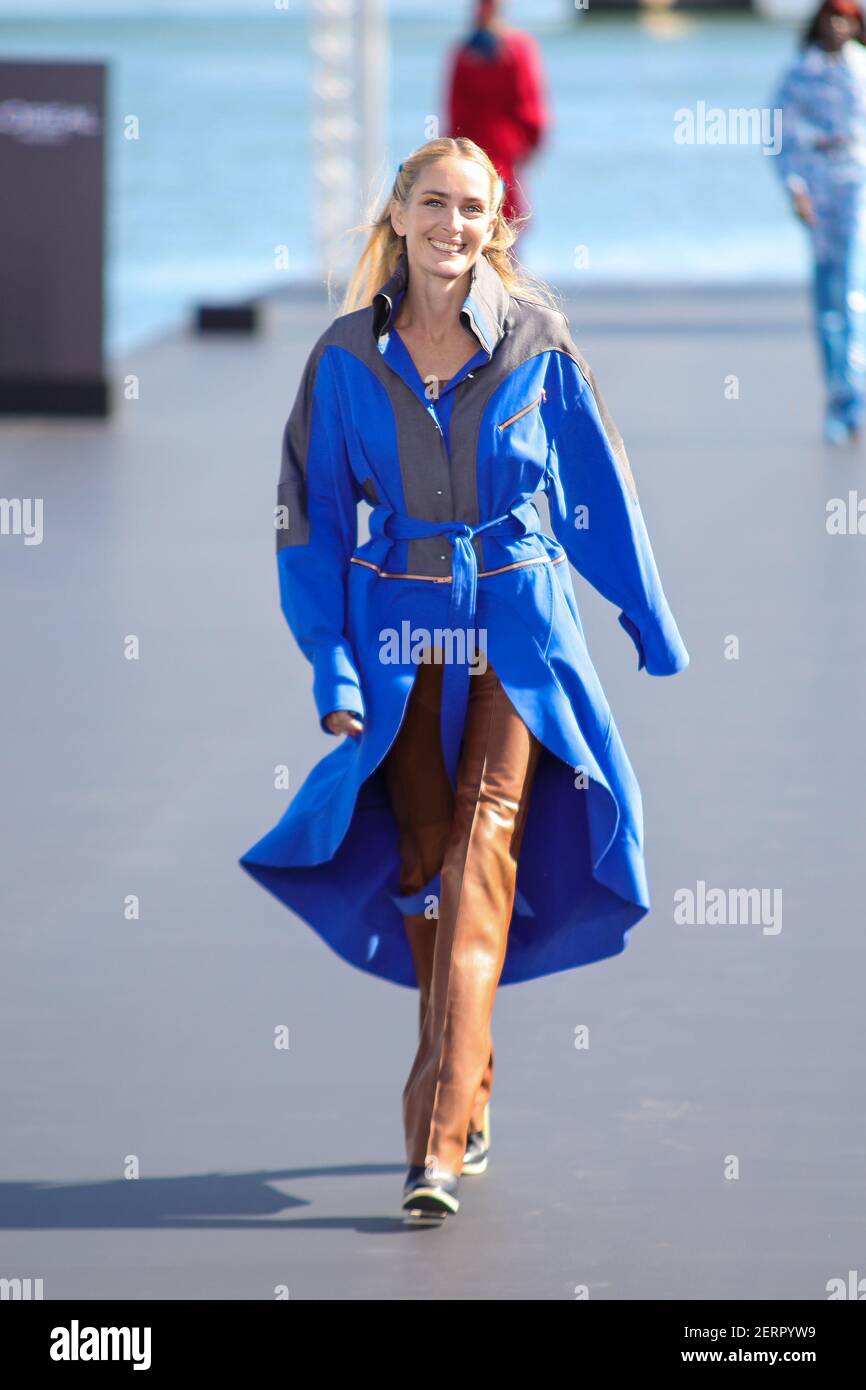 A model walks the L'Oréal Fashion Show runway during Paris Fashion Week ...