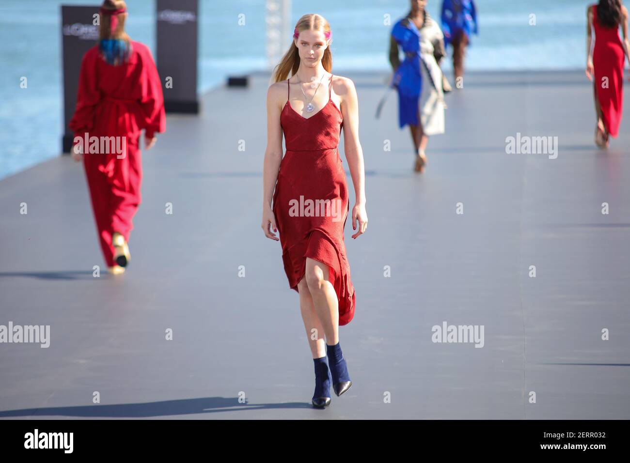 A model walks the L'Oréal Fashion Show runway during Paris Fashion Week ...