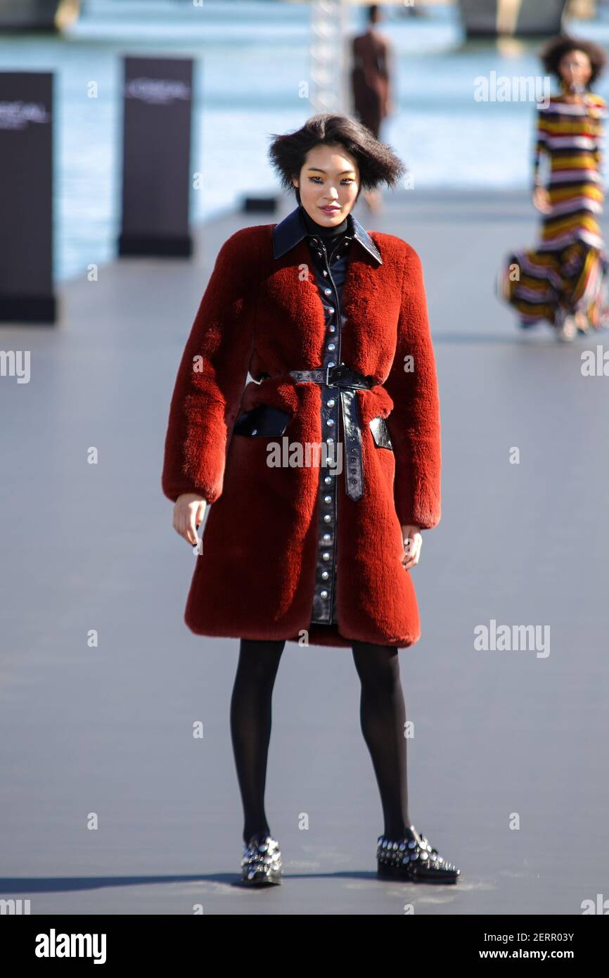 A model walks the L'Oréal Fashion Show runway during Paris Fashion Week ...