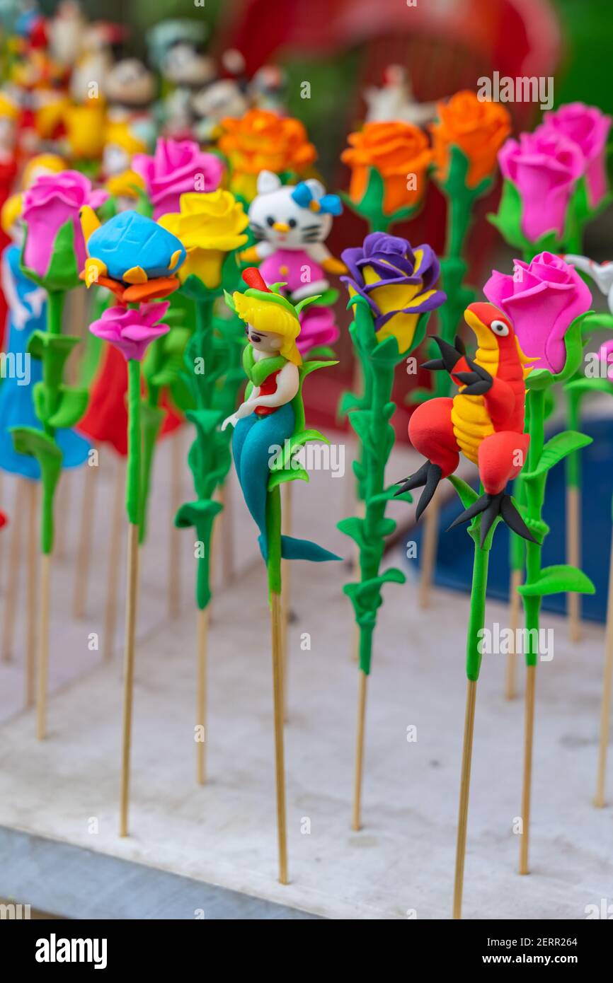 Vertical photo of tiny Chinese dough sculpture figures Stock Photo - Alamy