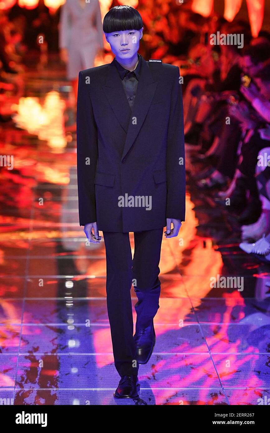 Model Takato Harashima walks on the runway during the Balenciaga ...