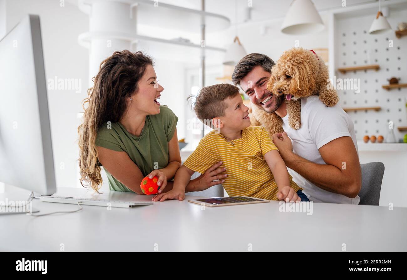 Happy family using technology devices together at home Stock Photo - Alamy