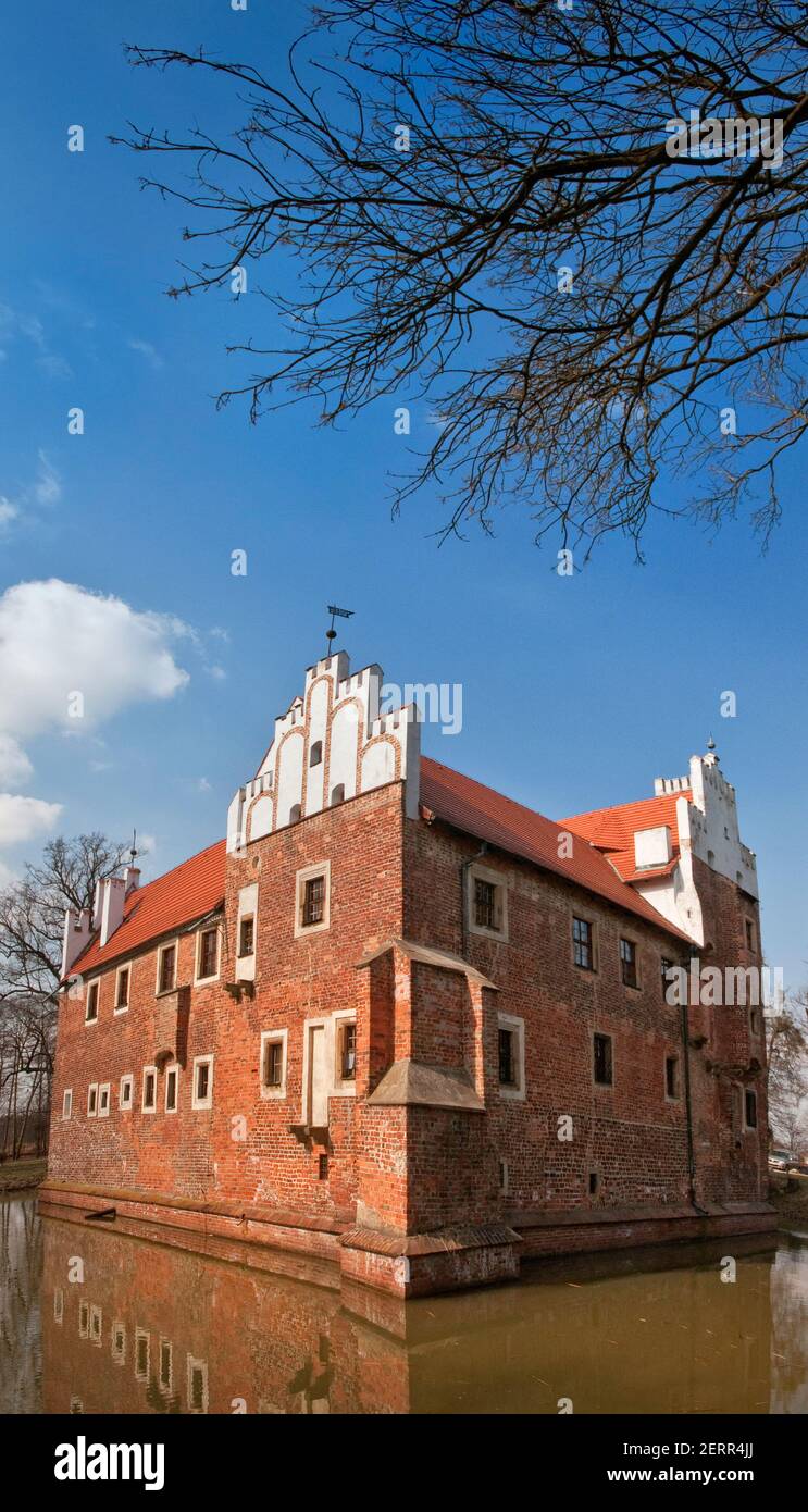 Medieval water castle, gothic-renaissance style, now hotel, in village ...