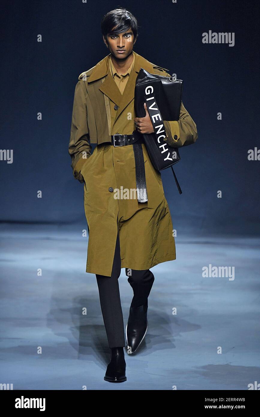 Model Jeenu Mahadevan walks on the runway during the Givenchy Fashion ...