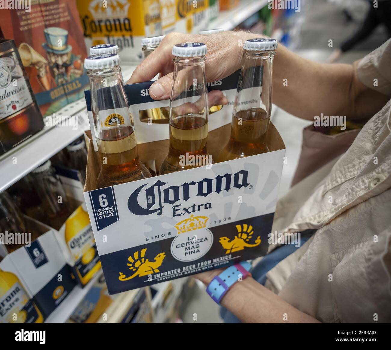 A shopper chooses a six-pack of Constellation Brands' Corona Extra beer ...
