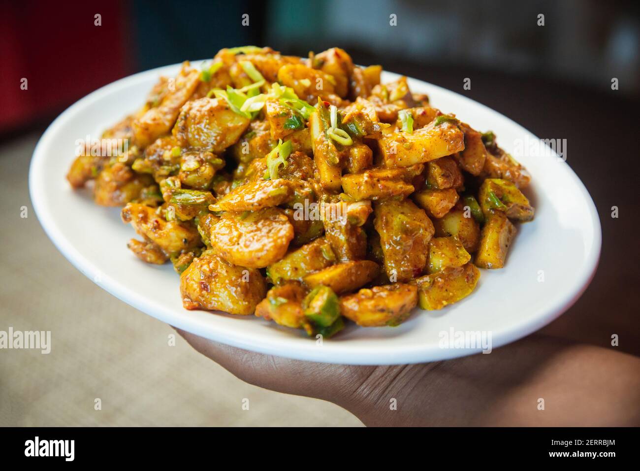 Popular Cucumber and potato pickle served on a plate. Alu kakra ko ...