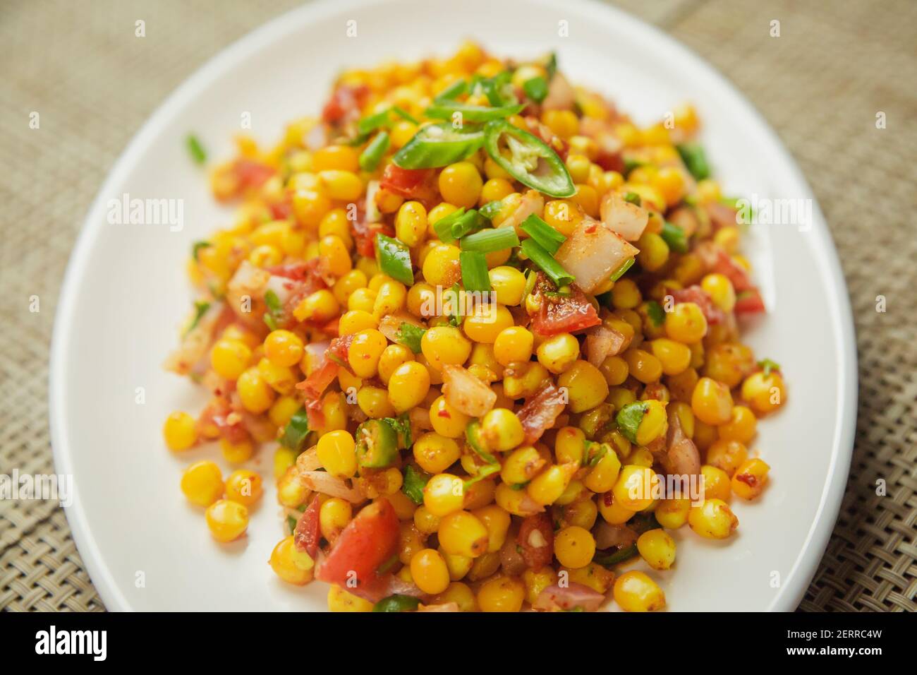 Spicy Sweet Corn Chaat in indian style served on a plate. Sweet Corn ...