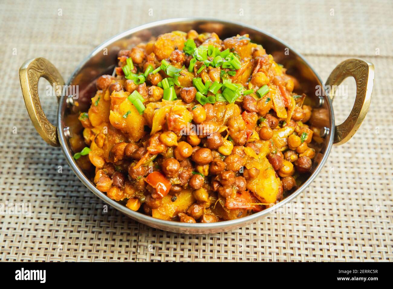 Potato and black chickpeas recipe,Alu chana in a bowl. Famous Nepali ...
