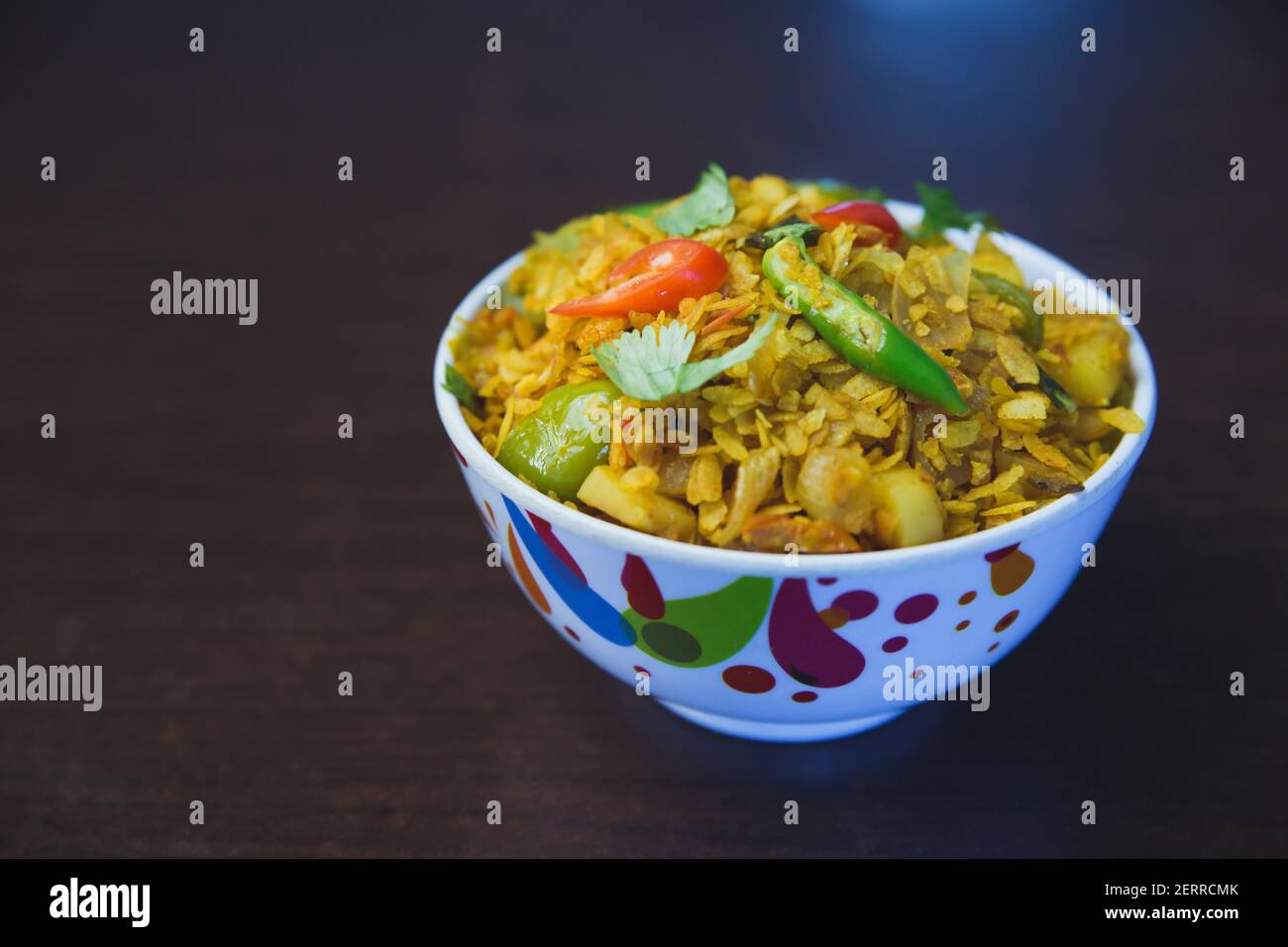 Fried beaten rice with potato,onion,capsicum and green chillies in ...