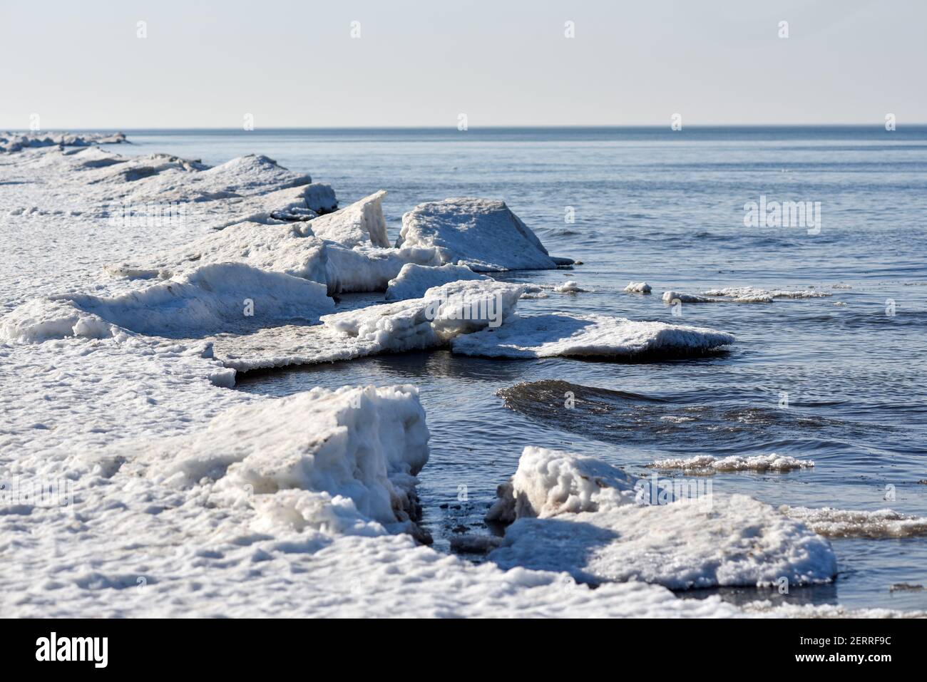 Winter seaside landscape, melting ice and snow on the beach Stock Photo ...