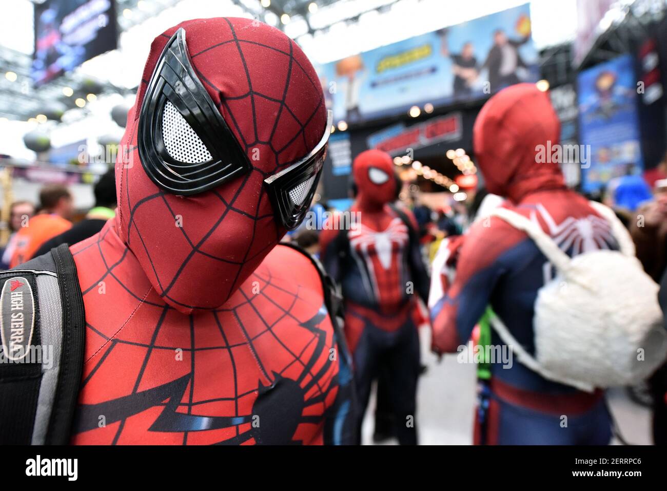 Three people in Spiderman costumes attend the 2018 NY Comic Con held at ...