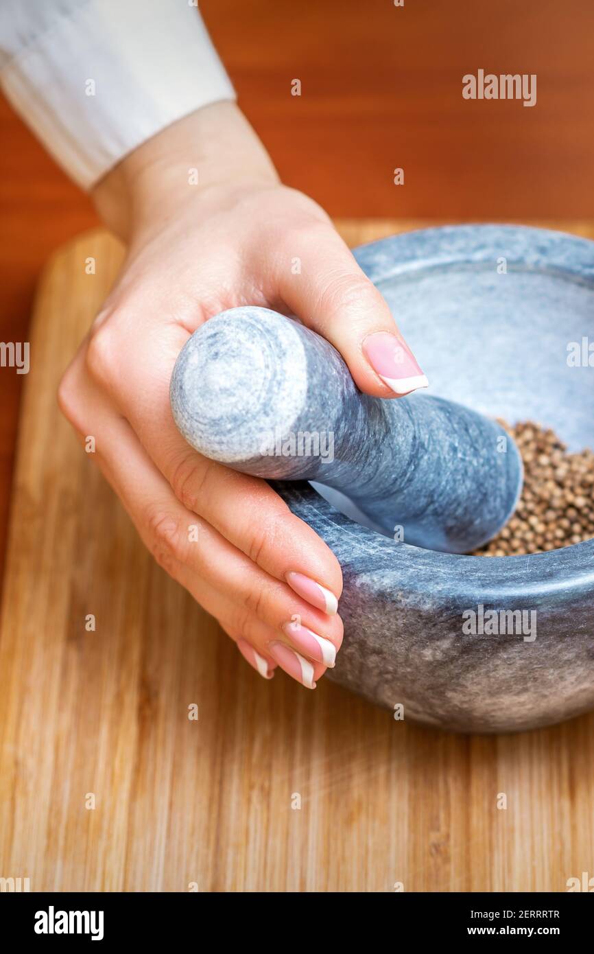 Woman grind spice hi-res stock photography and images - Alamy