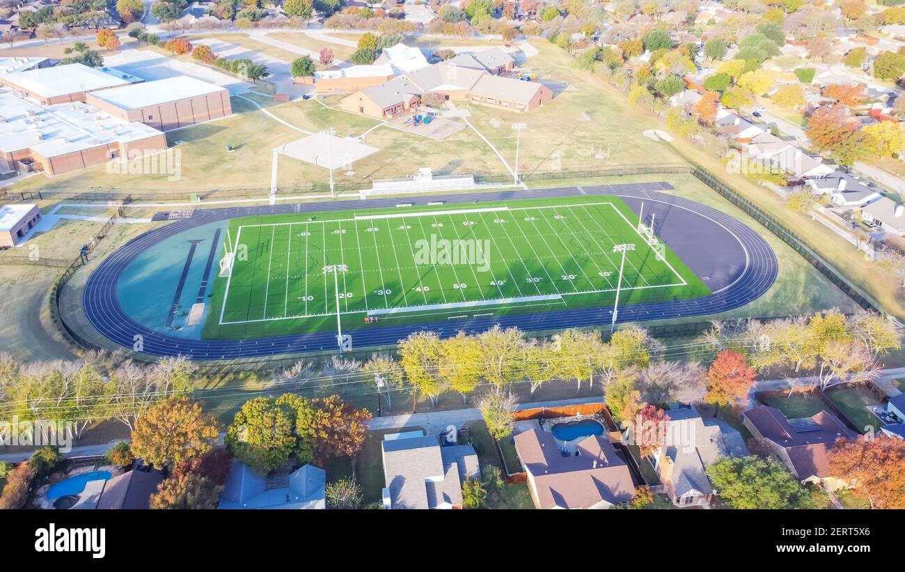 Top view school football field with running track, soccer goal ...