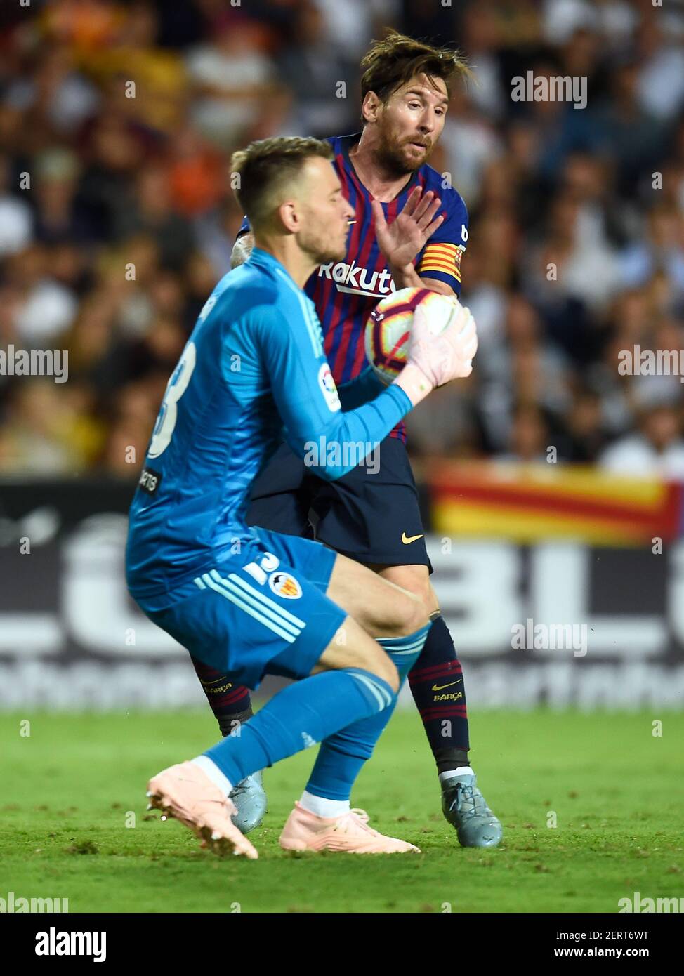 Lionel Messi of FC Barcelona and Norberto Murara Neto of Valencia CF ...