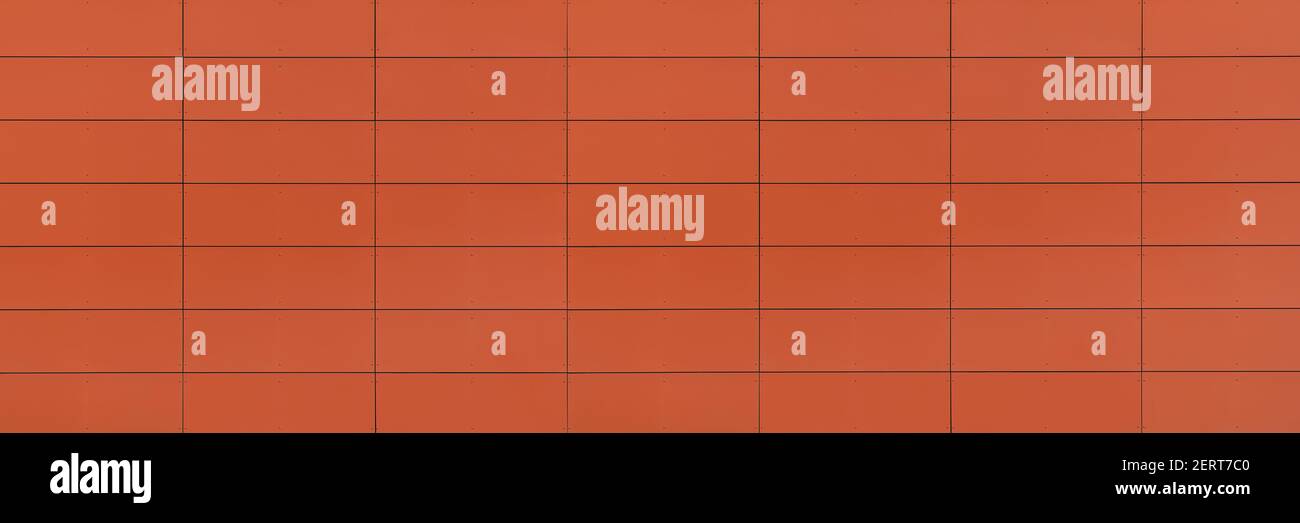 Panoramic facade made of square orange panels Stock Photo - Alamy