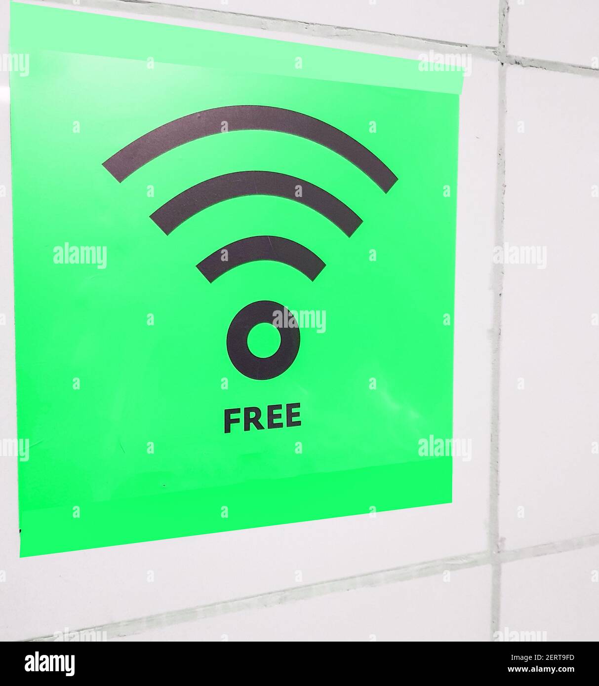 Free Wi-Fi zone symbol, green sign on a white wall in a public empty ...