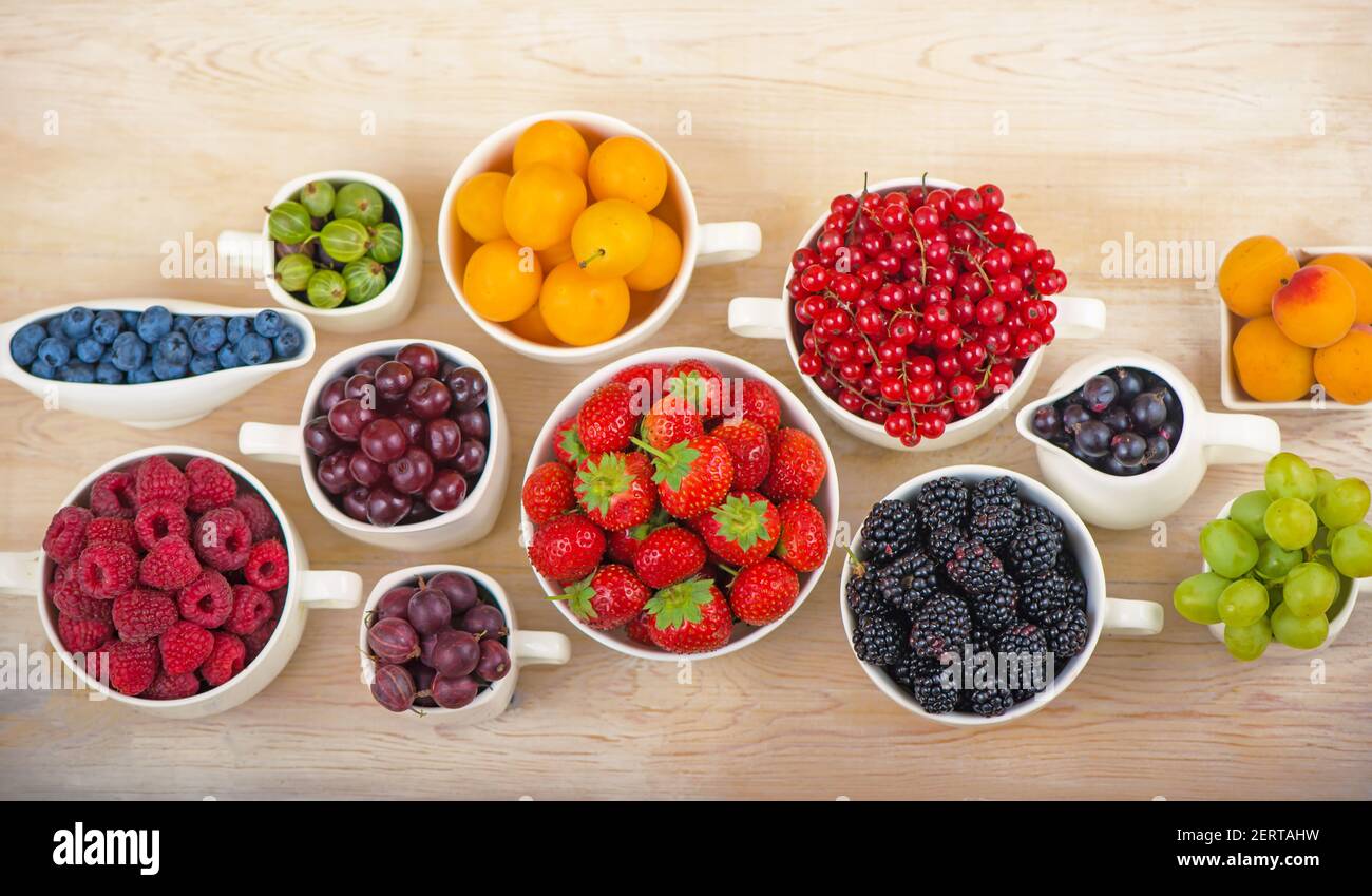 berry mix isolated on a white background Stock Photo - Alamy