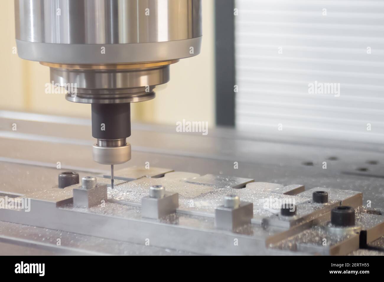 Automatic turning milling machine cutting metal workpiece at factory ...