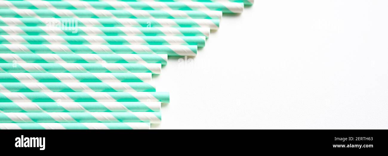 pile of paper striped white and green drinking straws for party on ...