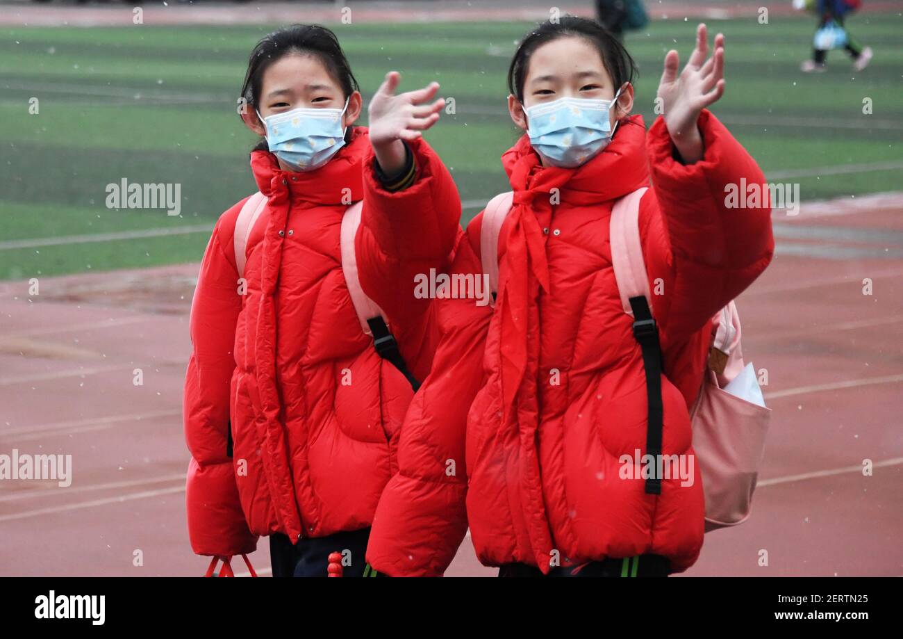 Beijing, China. 1st Mar, 2021. Students walk in the campus of Beijing ...