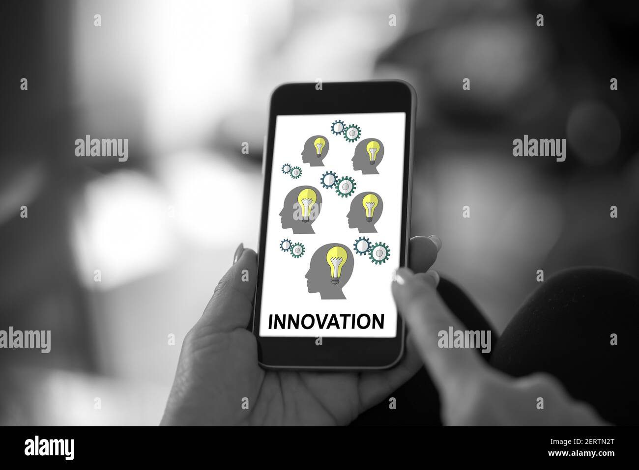 Hand holding a smartphone with innovation concept Stock Photo - Alamy