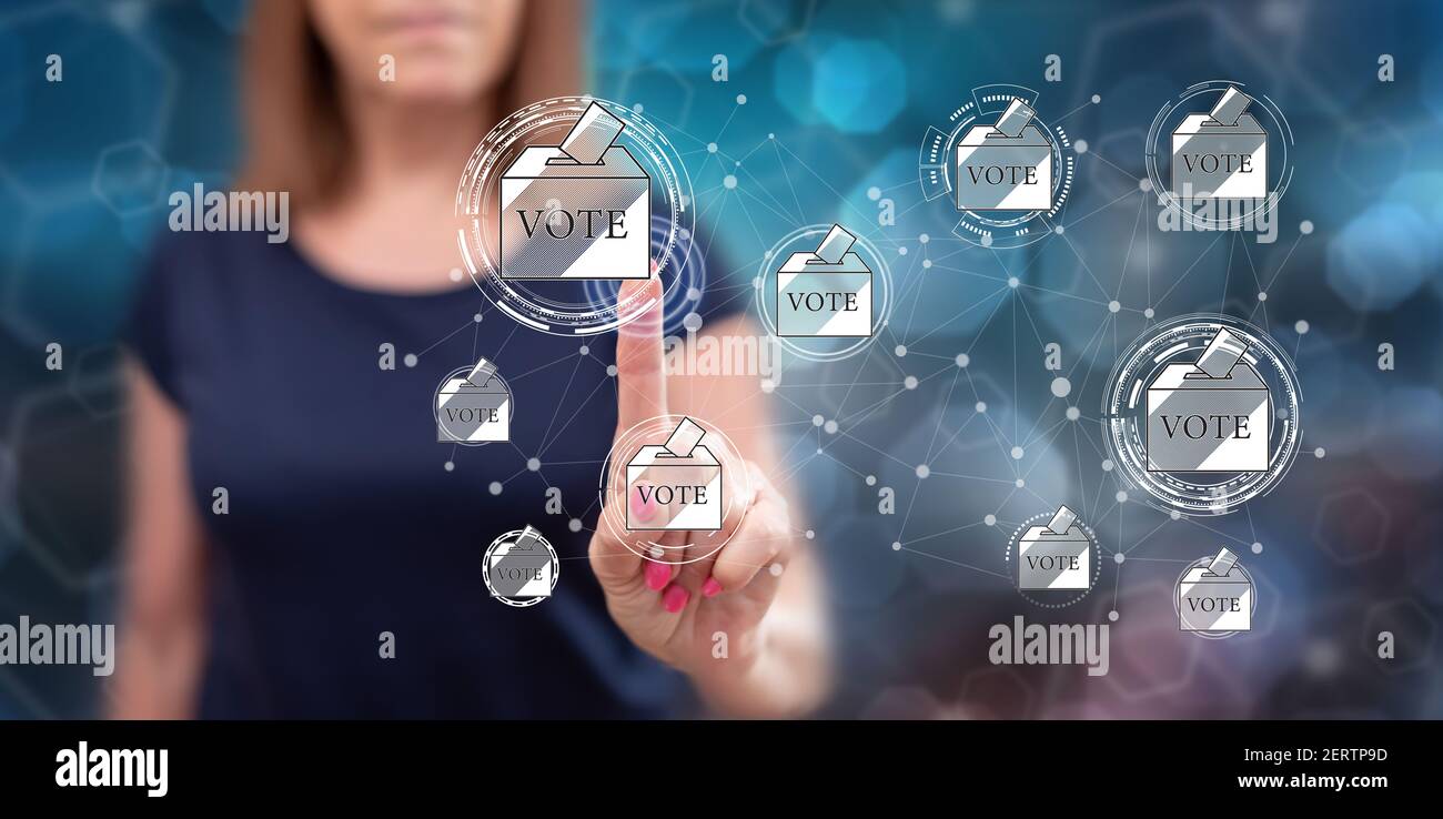 Woman touching an online voting concept on a touch screen with her ...