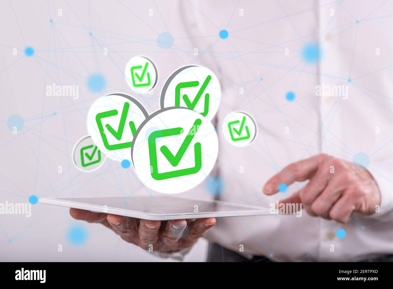 Validation concept above a tablet held by a man in background Stock ...