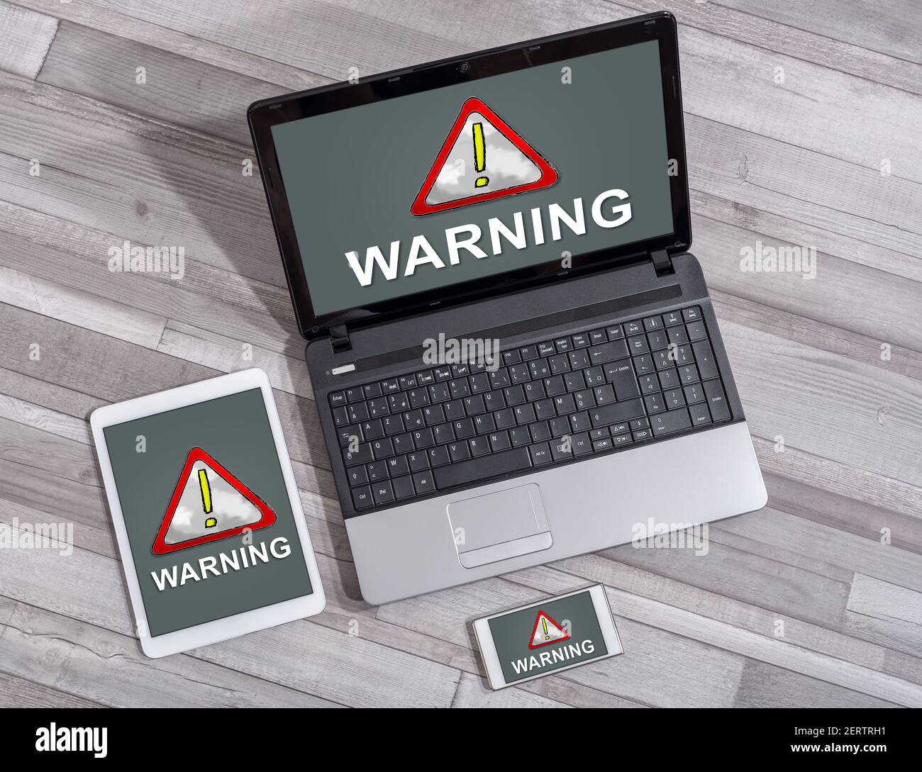 Warning concept shown on different information technology devices Stock ...